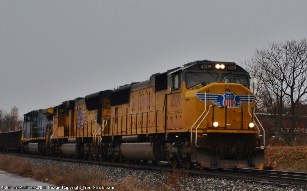 UP 4509 leads a full train of pipes.